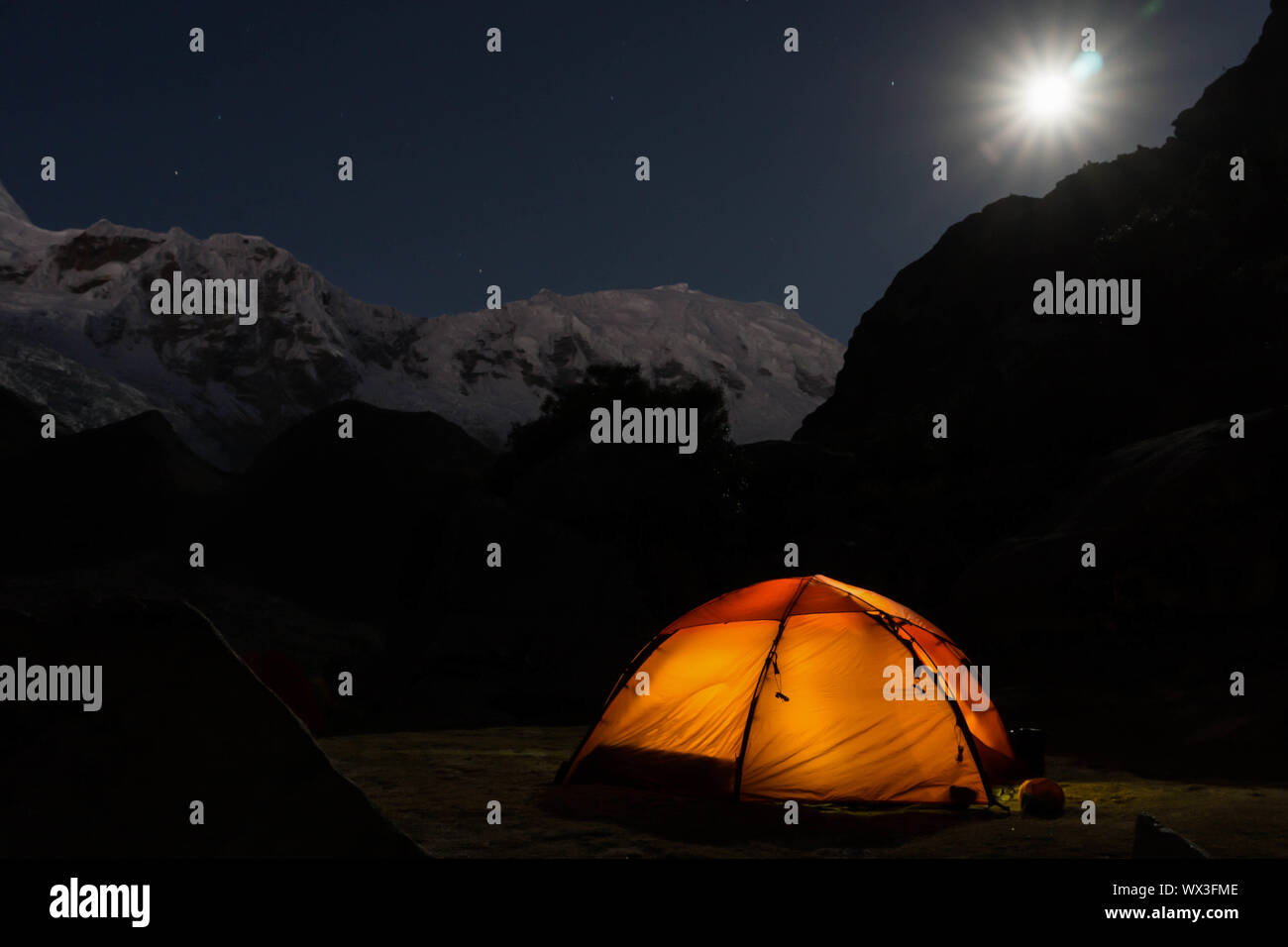 camping under a full moon in the mountains Stock Photo - Alamy