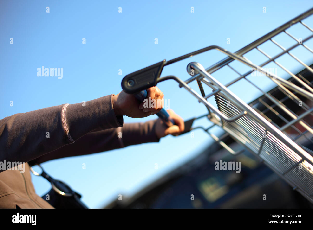 take cart in hands go shoping Stock Photo - Alamy