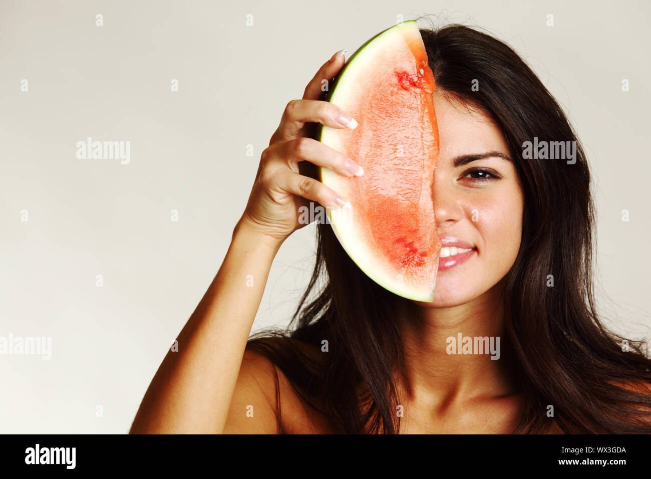 woman hold watermelon in hands isolated on white Stock Photo - Alamy