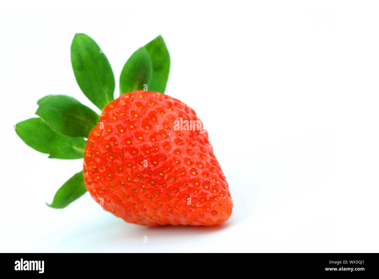 one strawberry isolated on white Stock Photo - Alamy