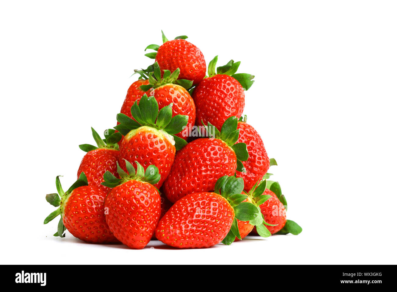 strawberry pile isolated on white background Stock Photo - Alamy