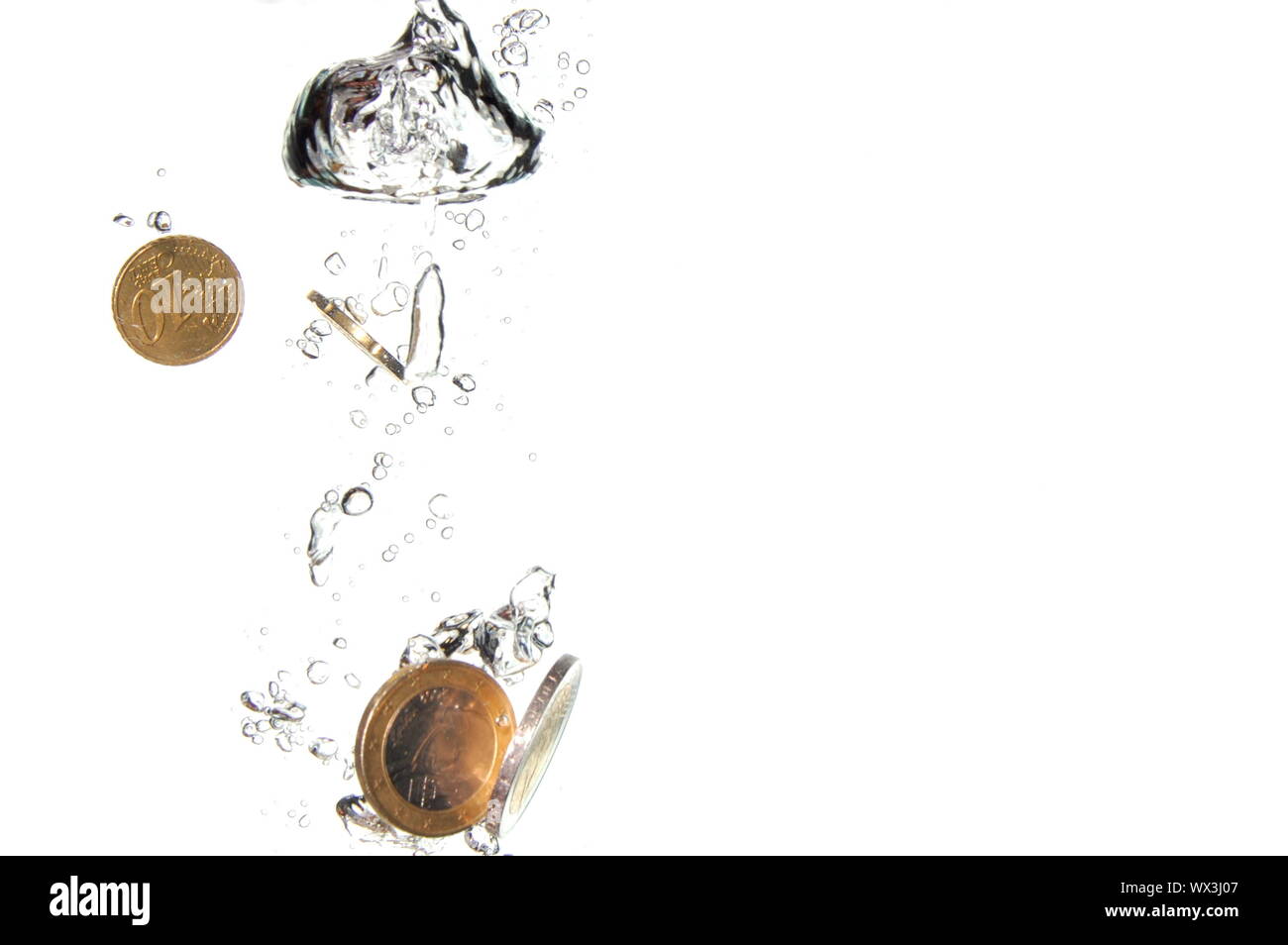 money in water with bubbles on white background Stock Photo - Alamy