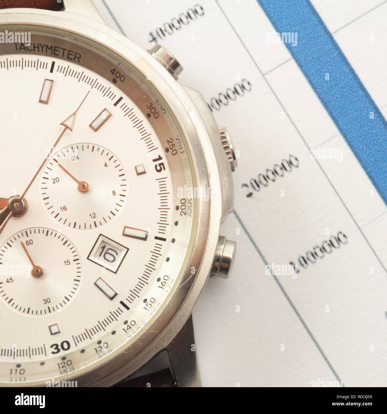 watch and business chart showing time concept Stock Photo - Alamy