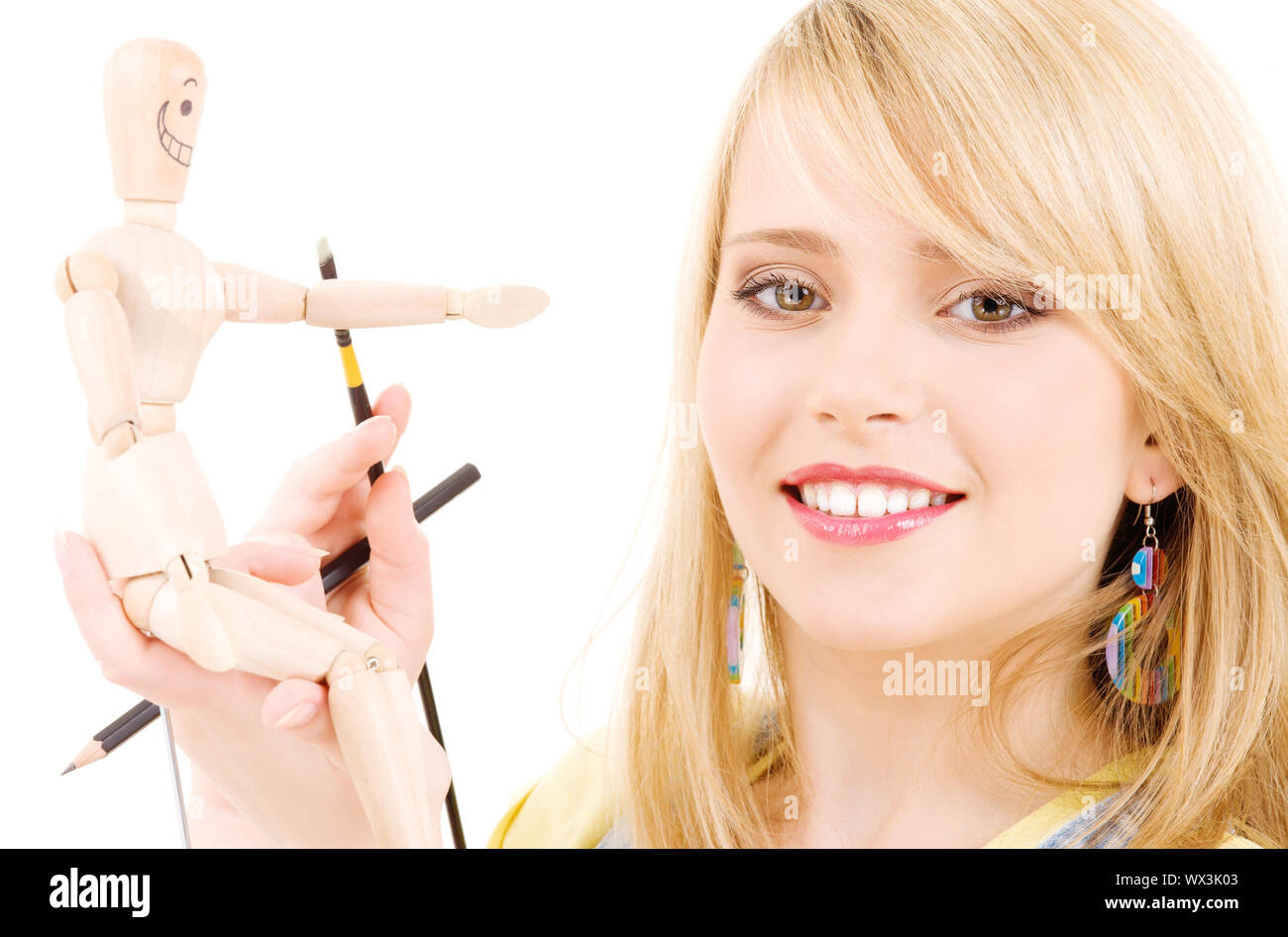 happy teenage girl with wooden model dummy over white Stock Photo - Alamy