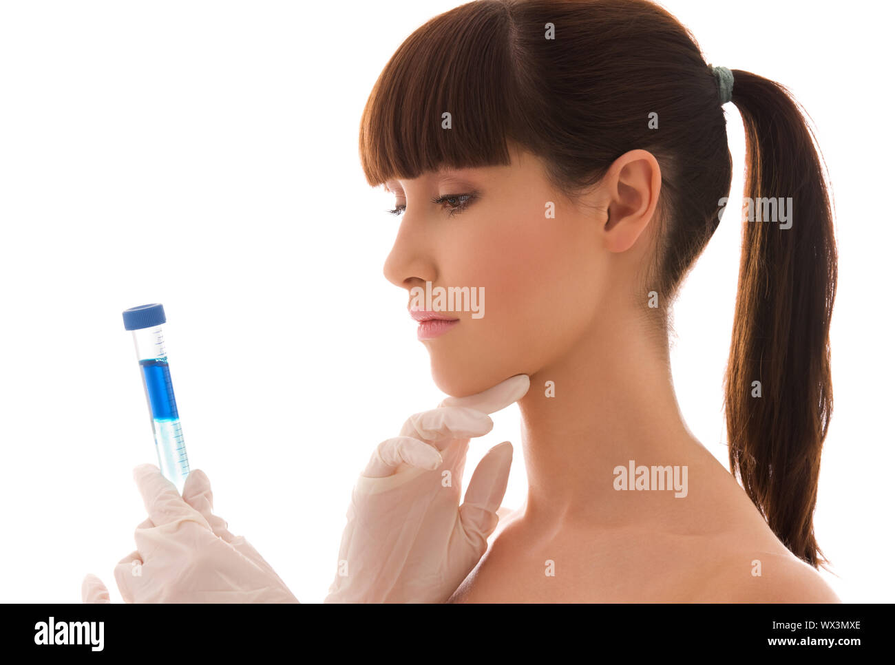 beautiful female lab worker holding up test tube Stock Photo - Alamy