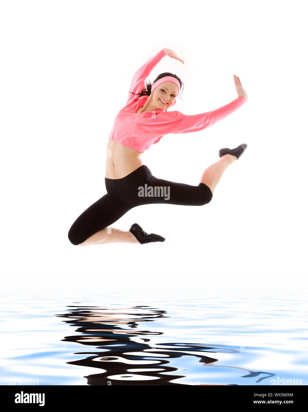 picture of happy girl jumping over water Stock Photo - Alamy