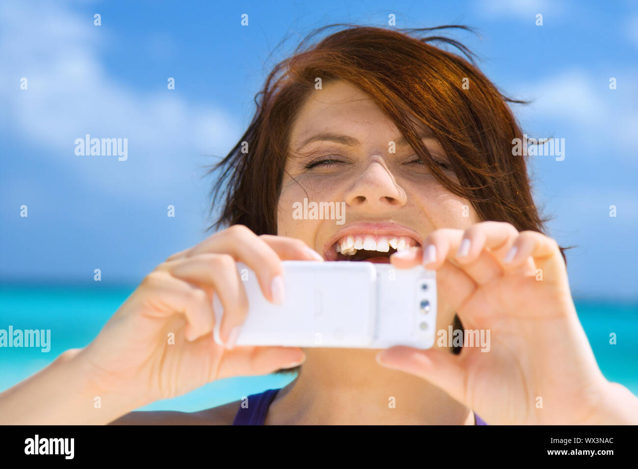 picture of happy woman using phone camera Stock Photo - Alamy