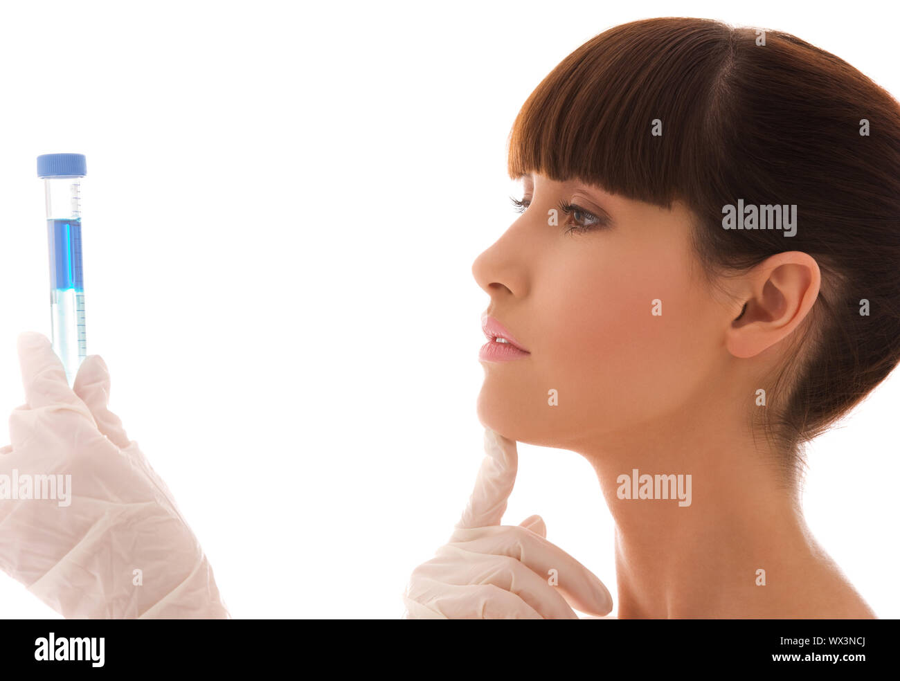 beautiful female lab worker holding up test tube Stock Photo - Alamy