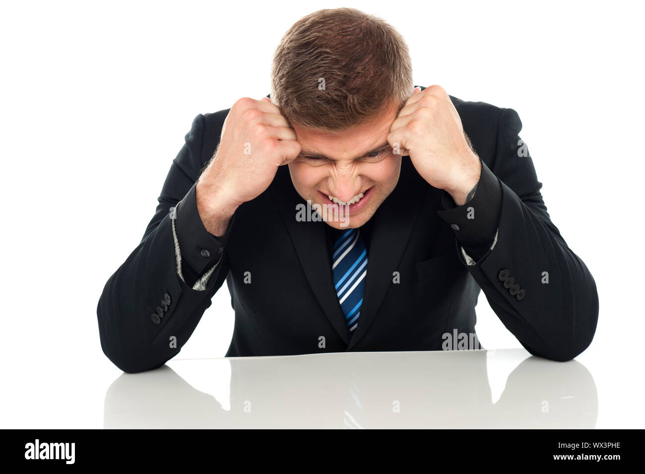 Frustrated businessman. Hands on his head Stock Photo - Alamy