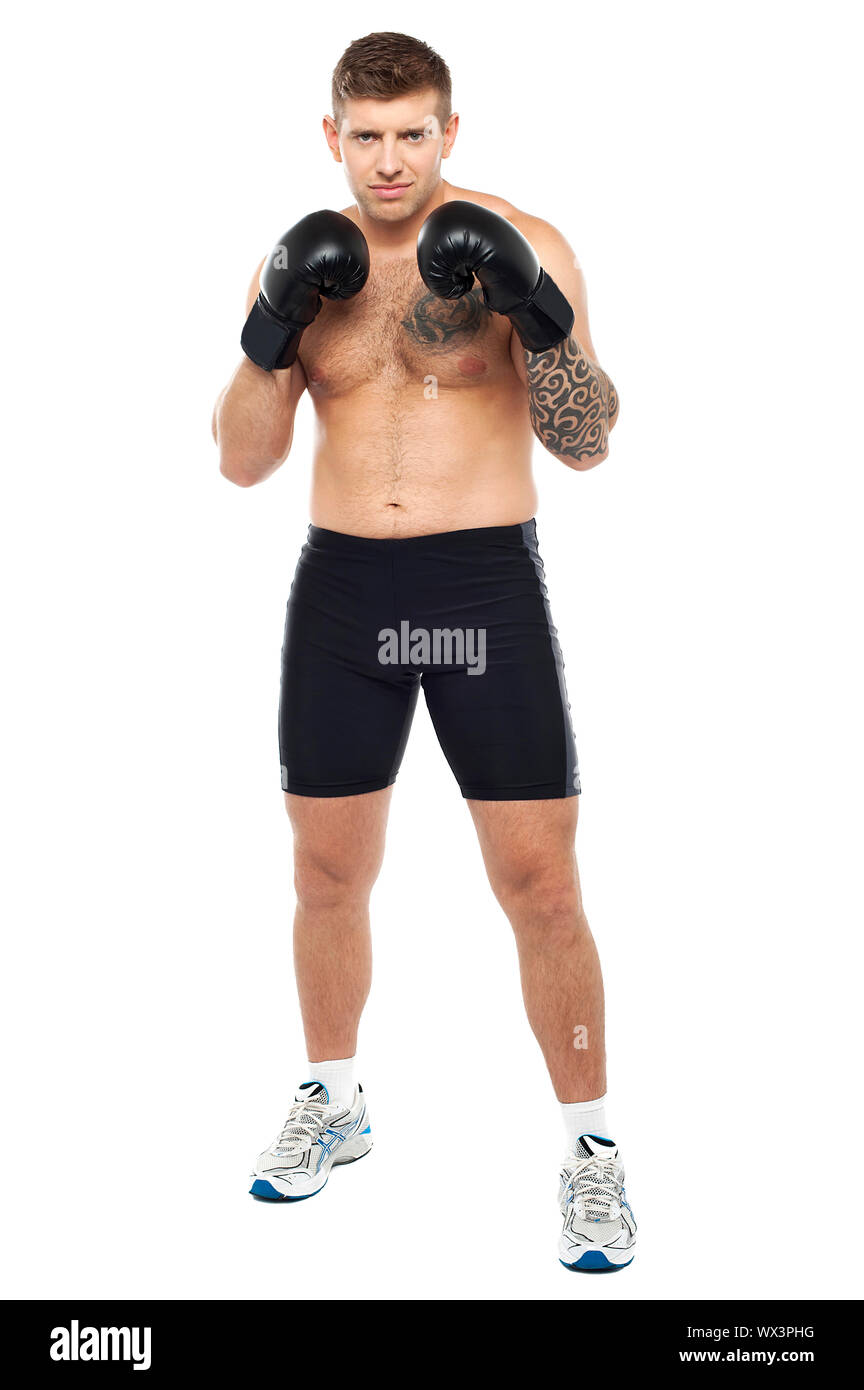 Full length portrait of isolated attractive boxer posing on white ...