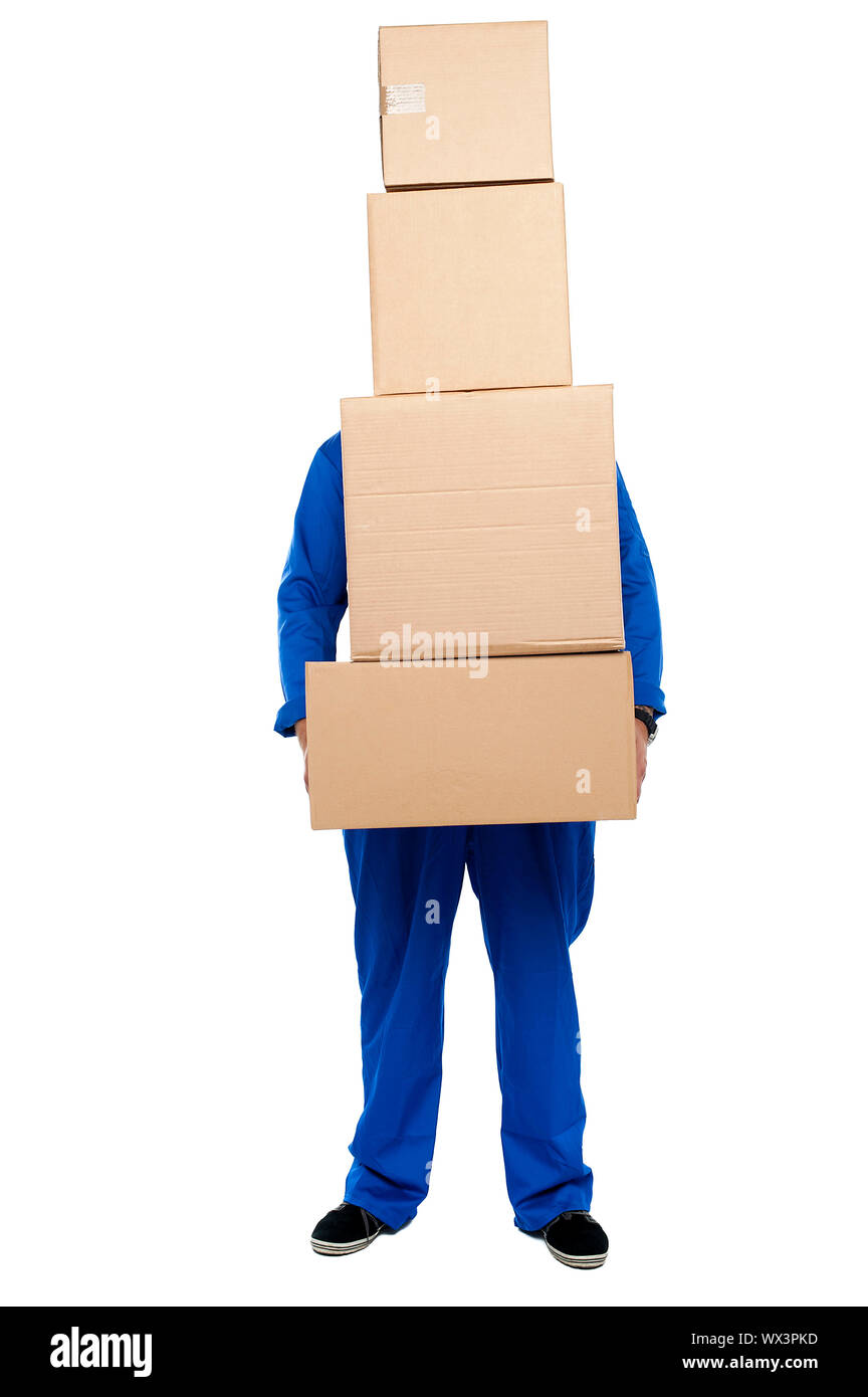 Guy overloaded with pile of cartons isolated against white background ...