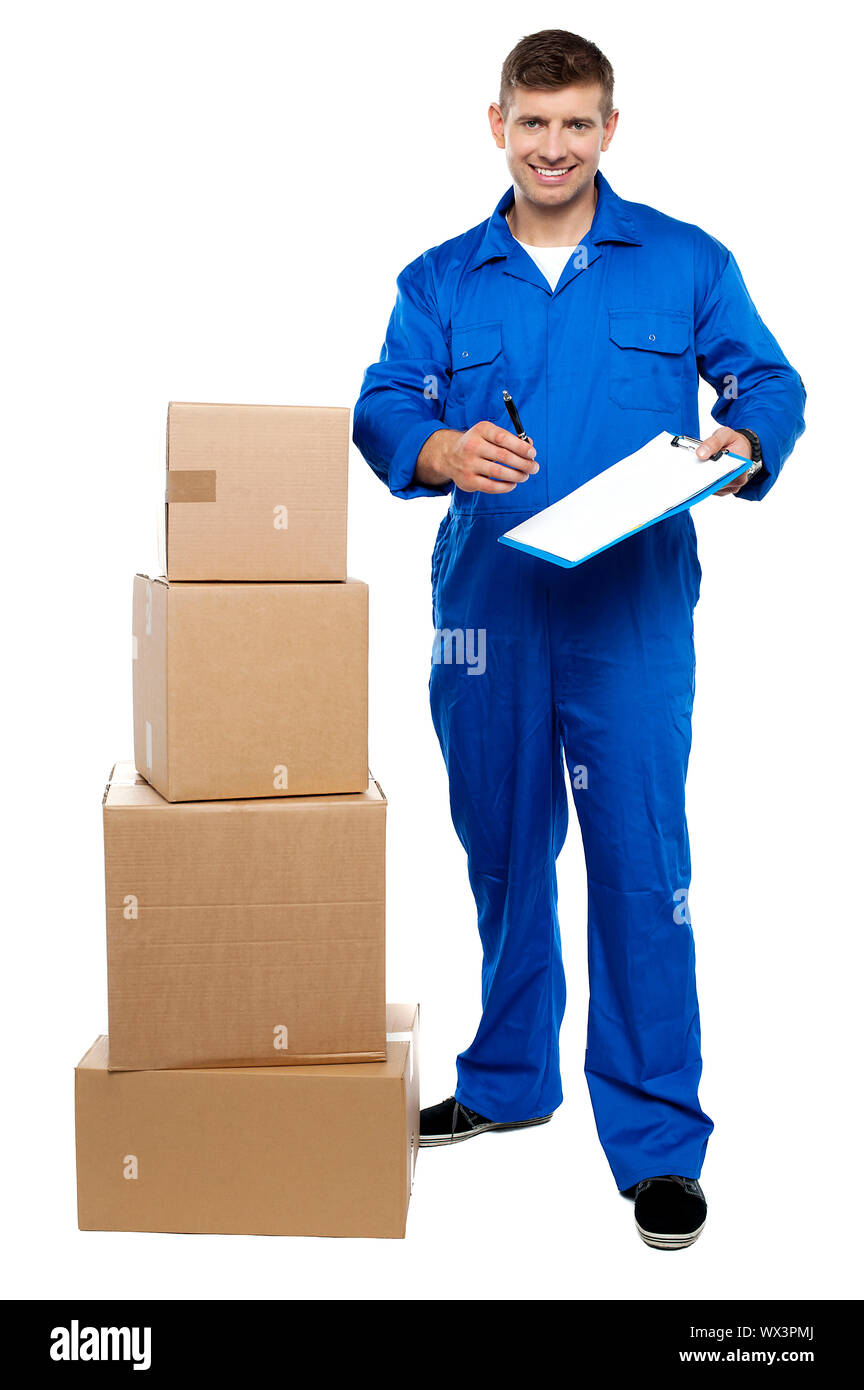 Courier staff offering pen and clipboard to recipient for signature ...