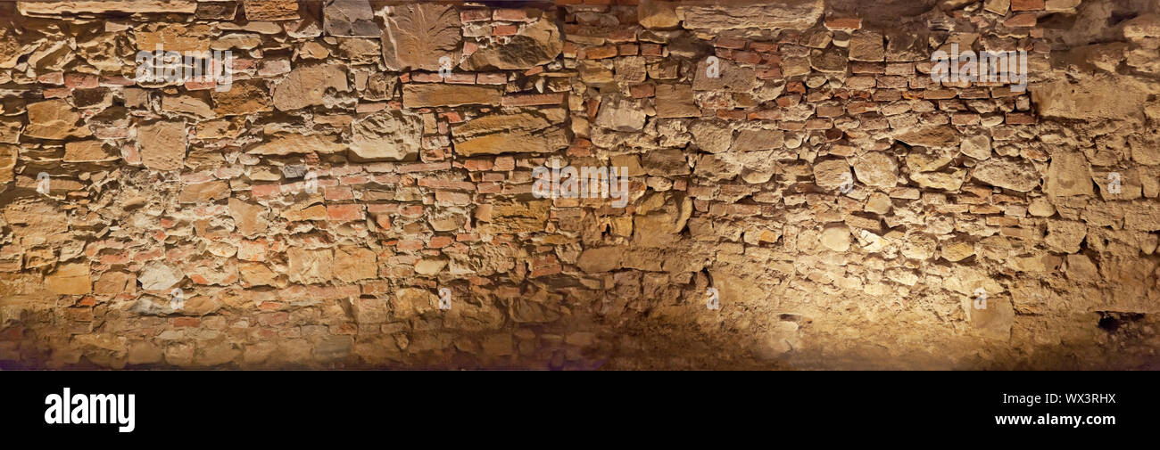 Rough stone wall in poster size Stock Photo - Alamy