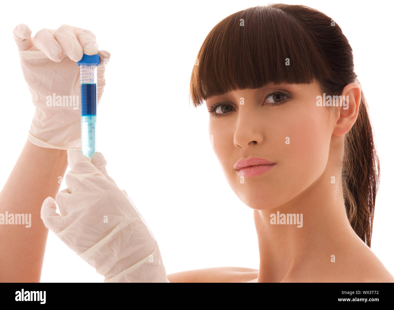 beautiful female lab worker holding up test tube Stock Photo - Alamy