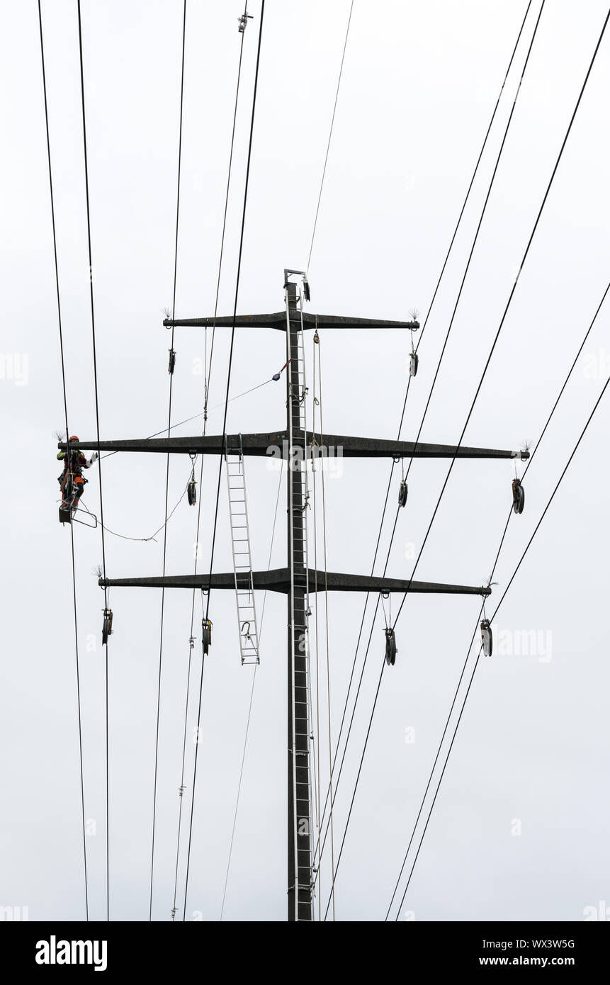 Man working on high voltage power lines hi-res stock photography and ...