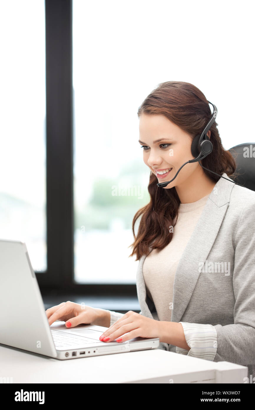 picture of helpline operator with laptop computer Stock Photo - Alamy