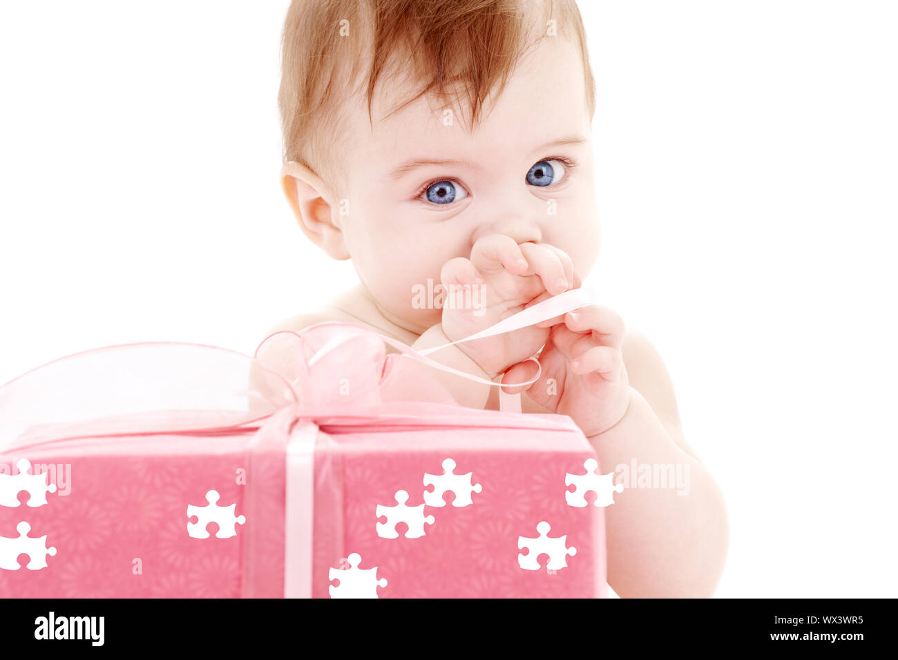 puzzle picture of baby boy with big gift box Stock Photo - Alamy