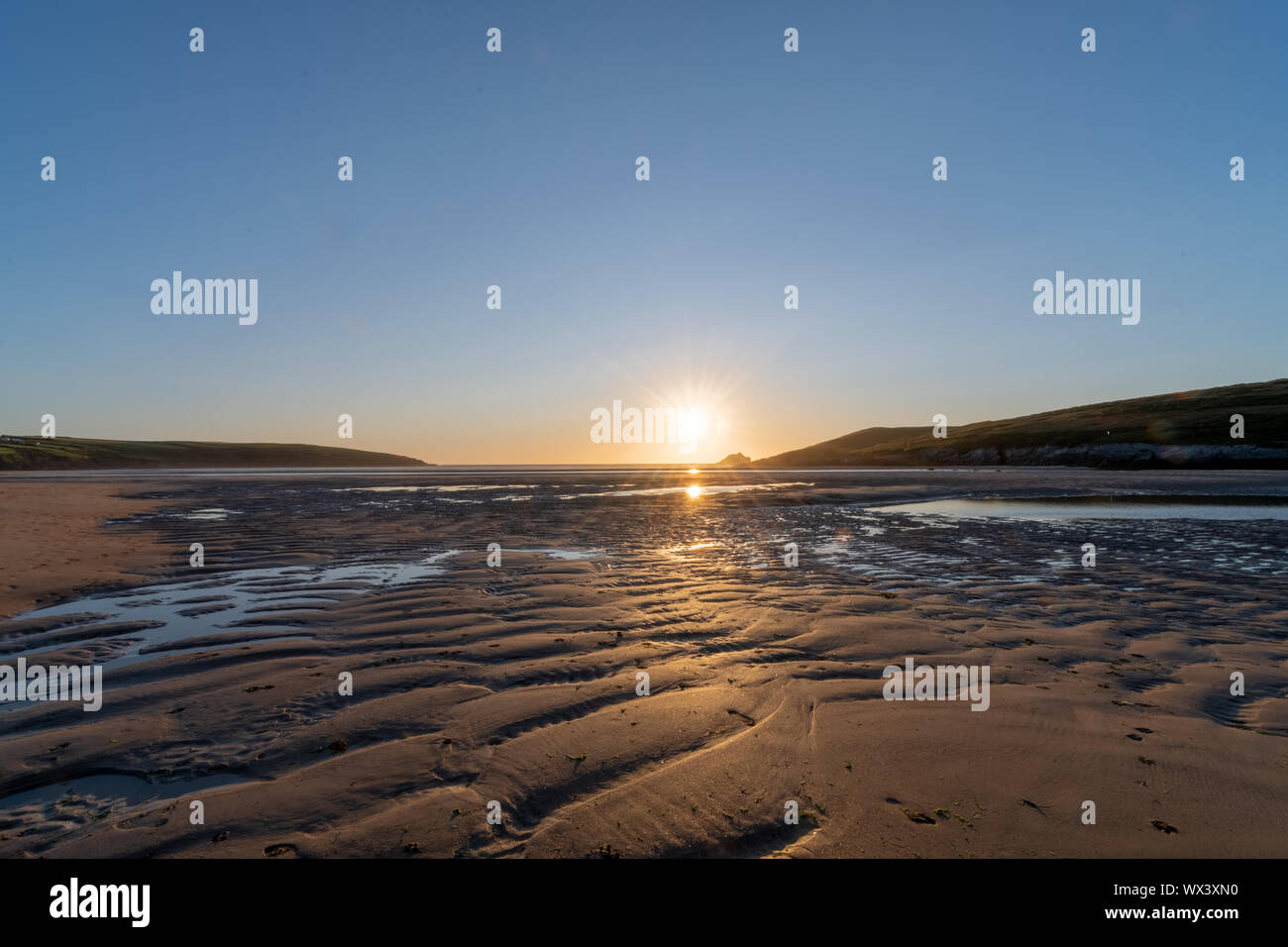 Landscape photo of the sun setting over Crantock beach in Cornwall ...