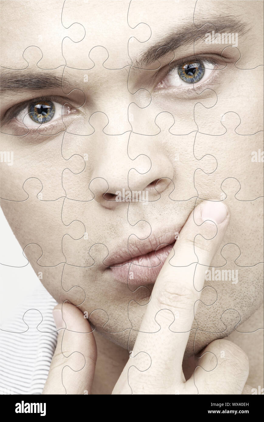 puzzle portrait of handsome man with blue eyes Stock Photo - Alamy