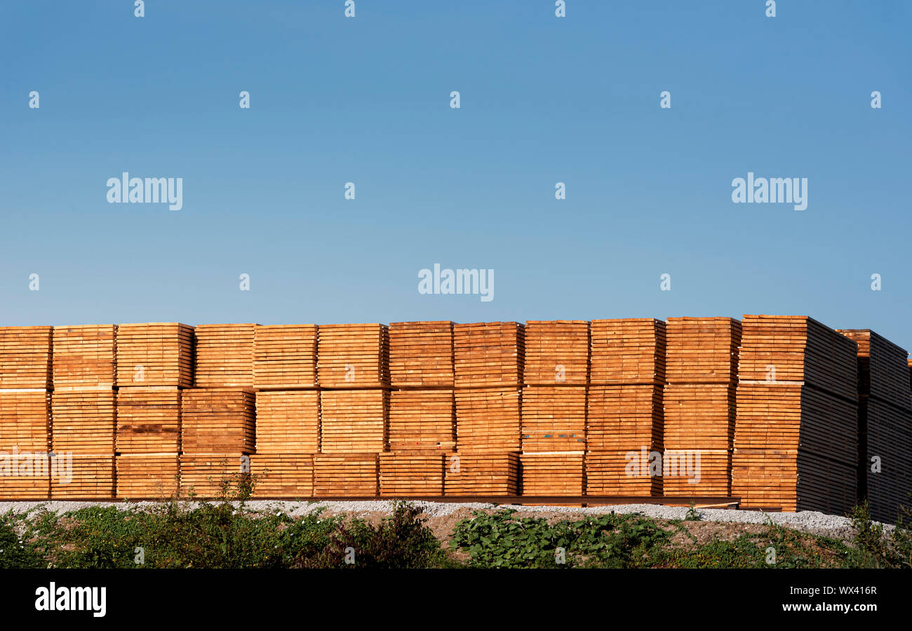 Wood stock outdoor. Stacks of timber planks. Wood industry in Germany ...