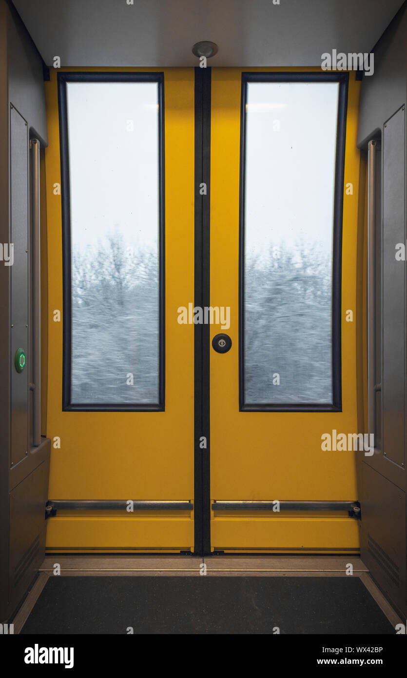 Automatic yellow doors from a modern train. Interior of a german ...