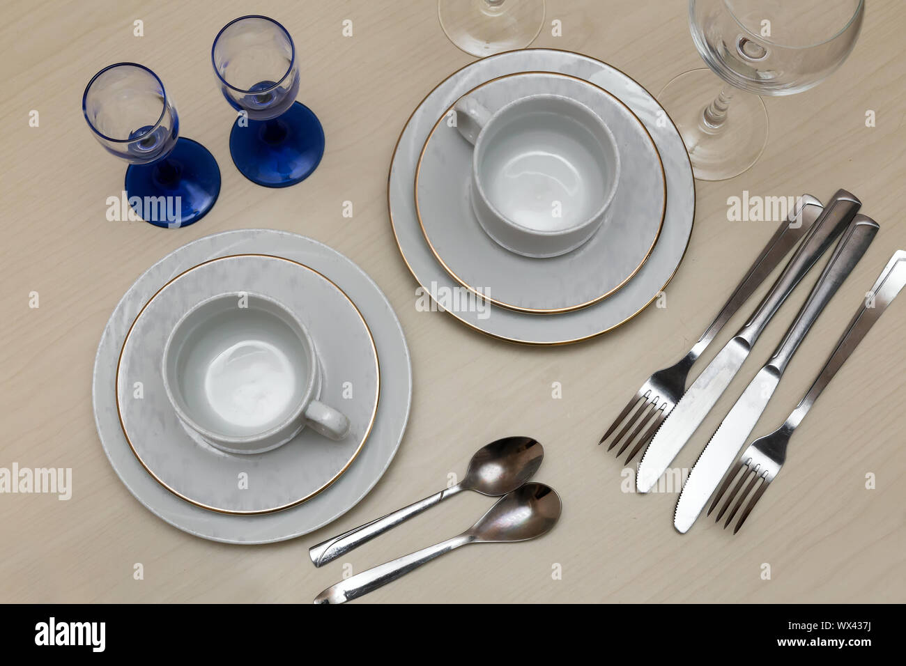 Set of dishes on the table for two persons Stock Photo - Alamy