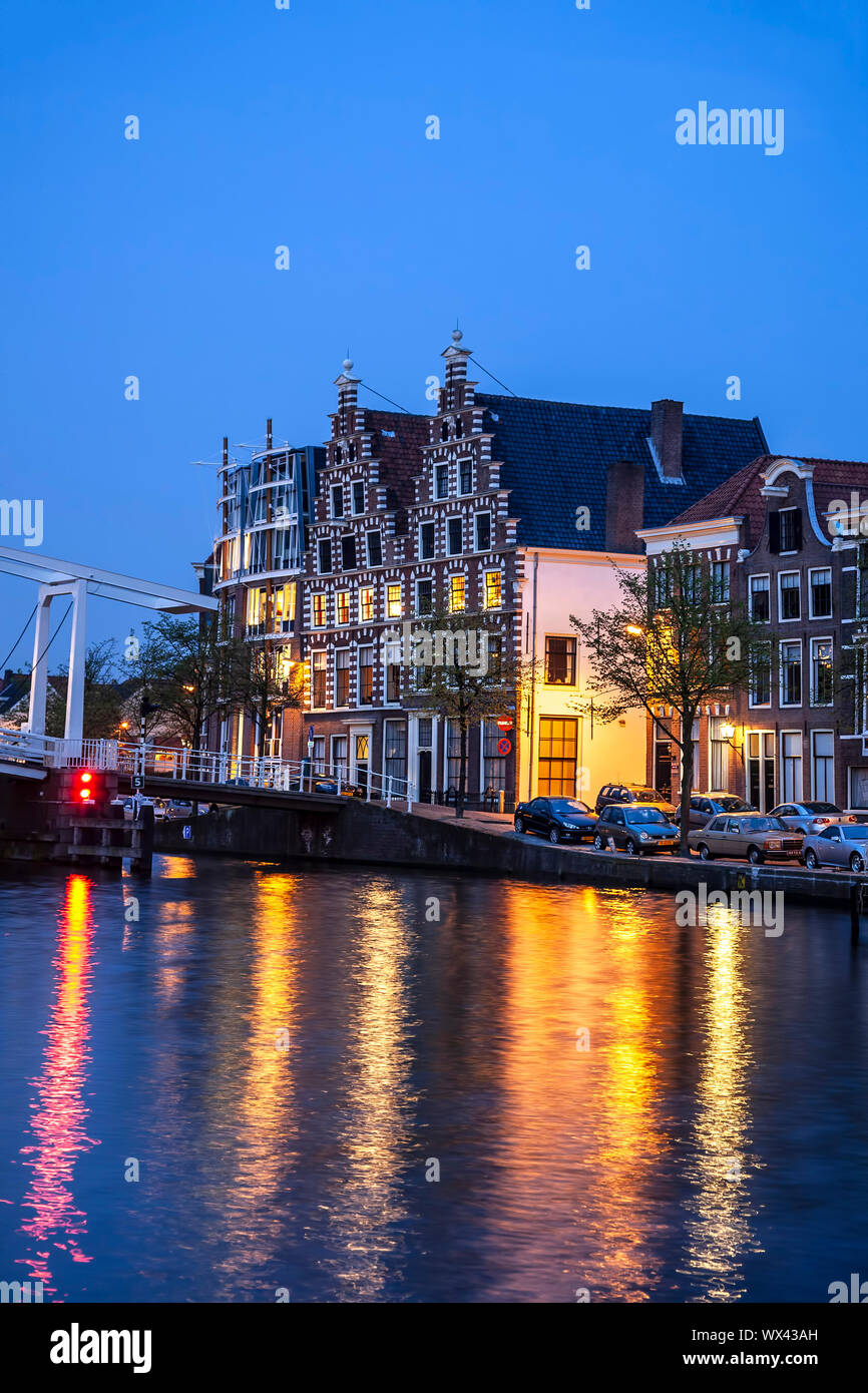Buildings at twilight, Spaarne River, Haarlem, Netherlands Stock Photo ...