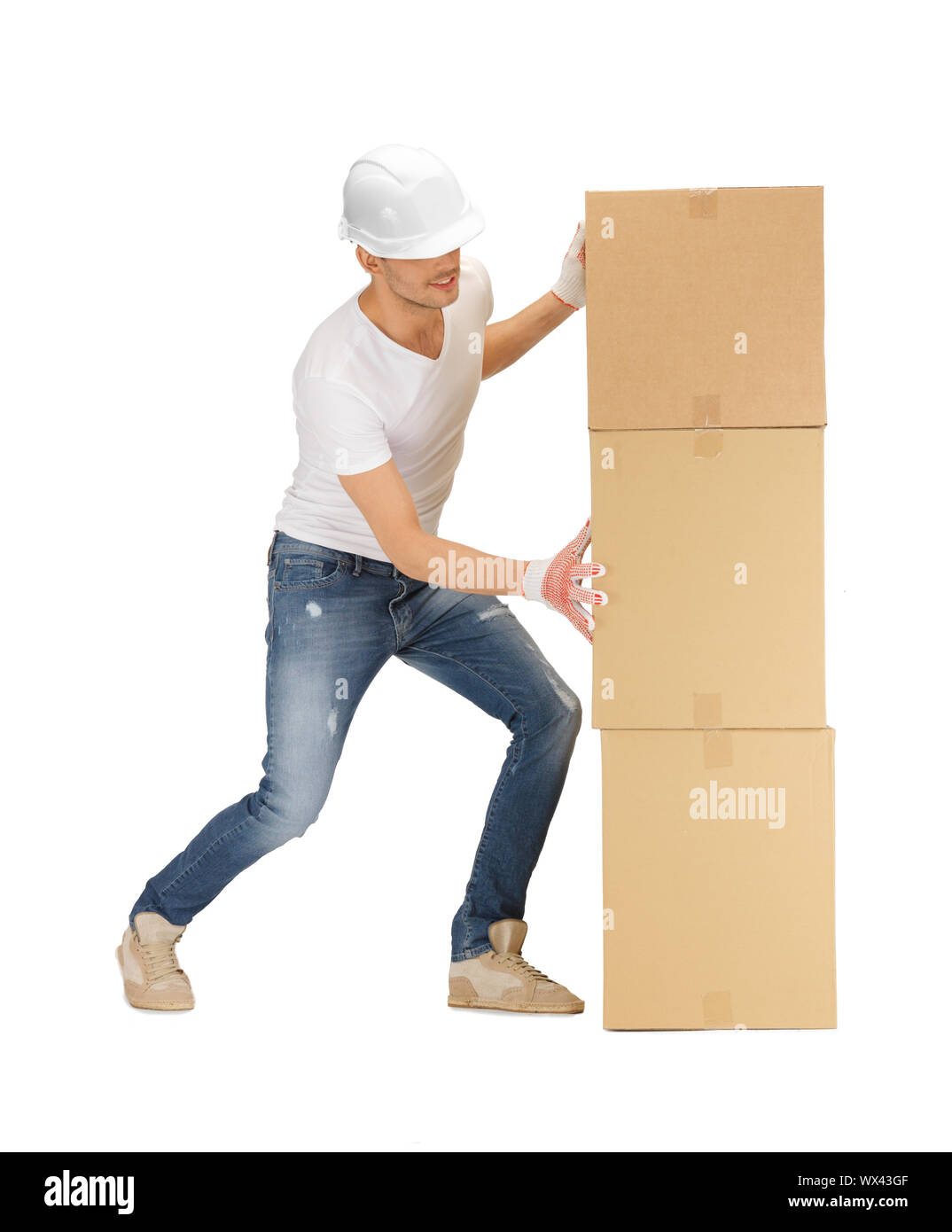 picture of handsome builder moving big boxes Stock Photo - Alamy