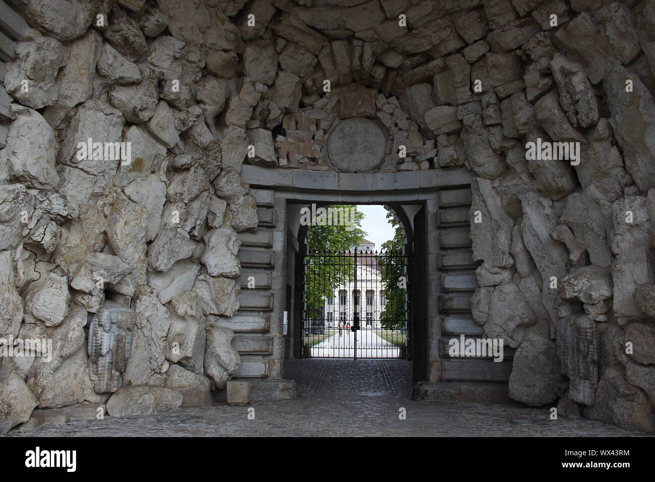 The rustic 'grotto' entrance to the Royal Saltworks at Arc-et-Senans ...