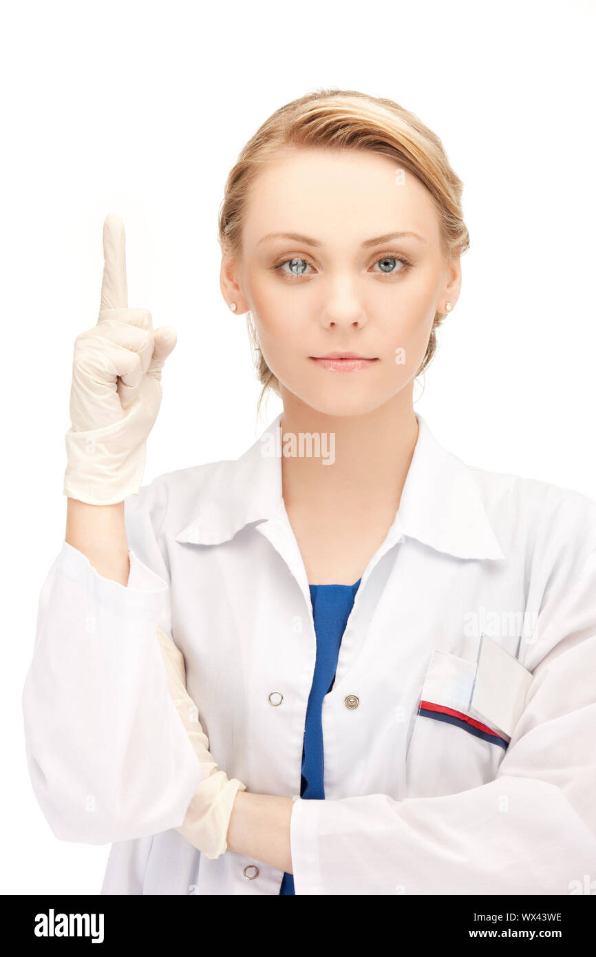 attractive female doctor with her finger up Stock Photo - Alamy