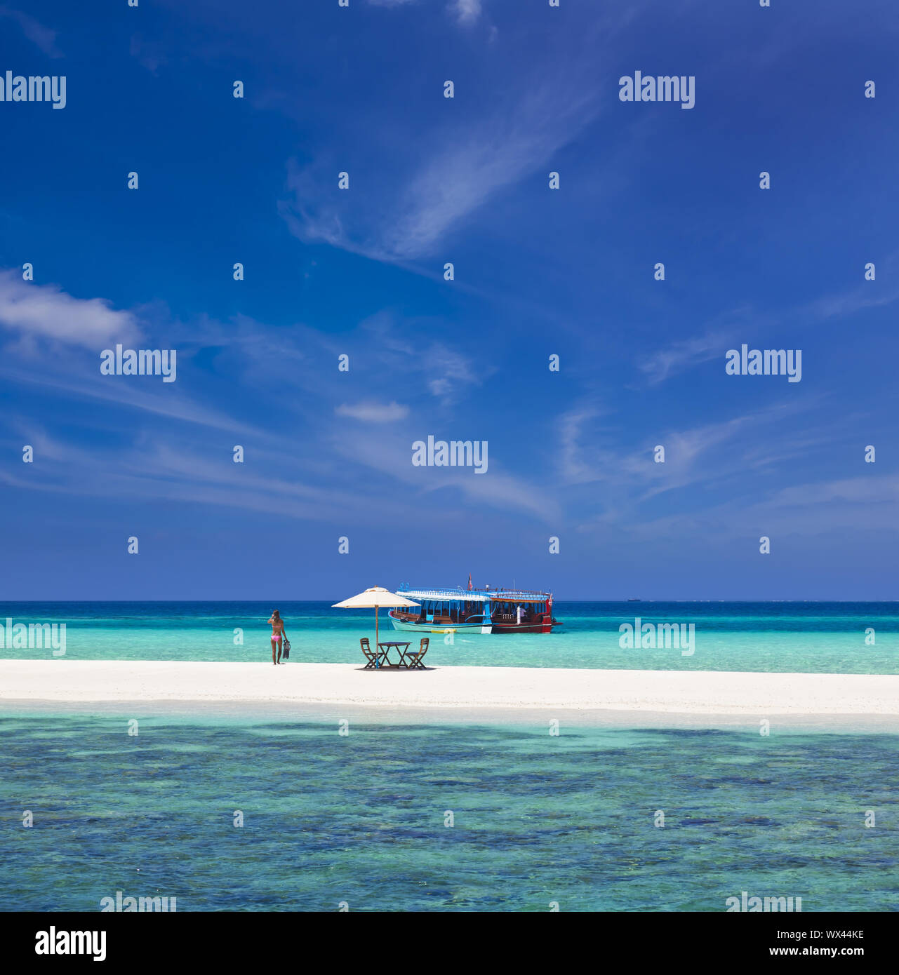 Beautiful Maldives beach with bikini model Stock Photo - Alamy