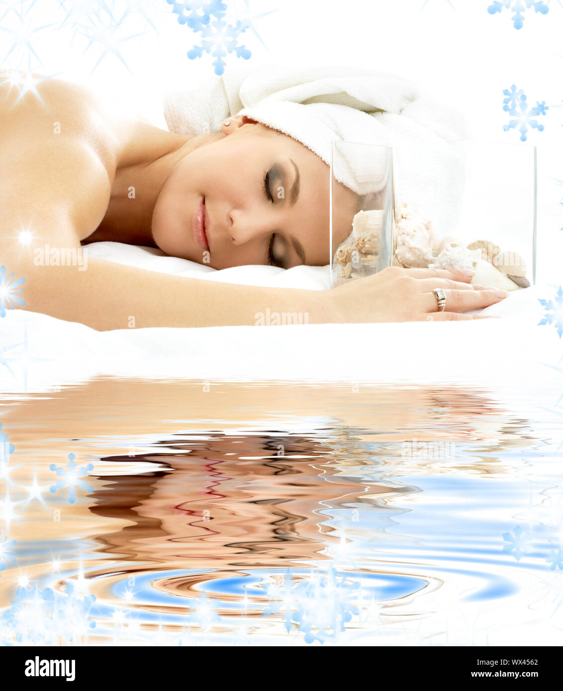 beautiful lady with sea shells in glass cube on white sand Stock Photo ...