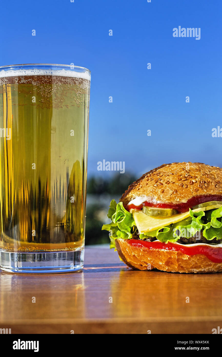 Delicious burger, glassr beer, grill, fastfood, close up Stock Photo ...