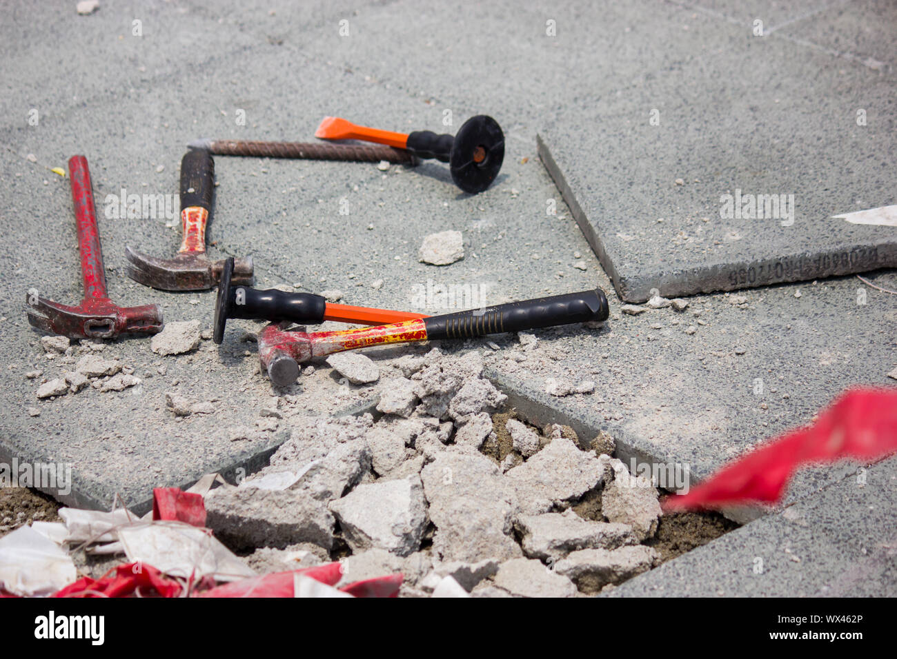 Group of Hand Equipment in the repairing process of footpath in the ...