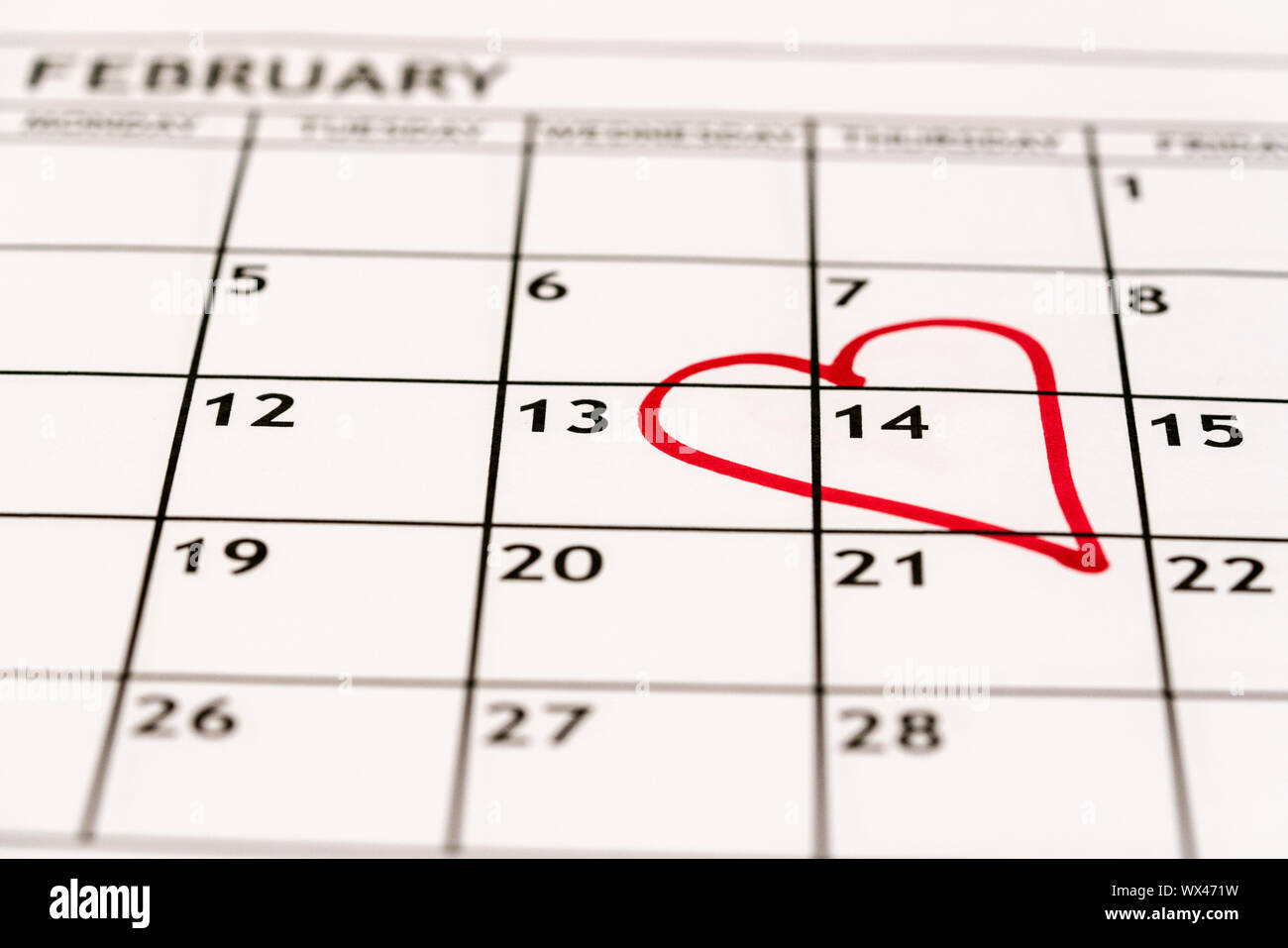 monthly calendar February detail view with a red heart drawn on the ...