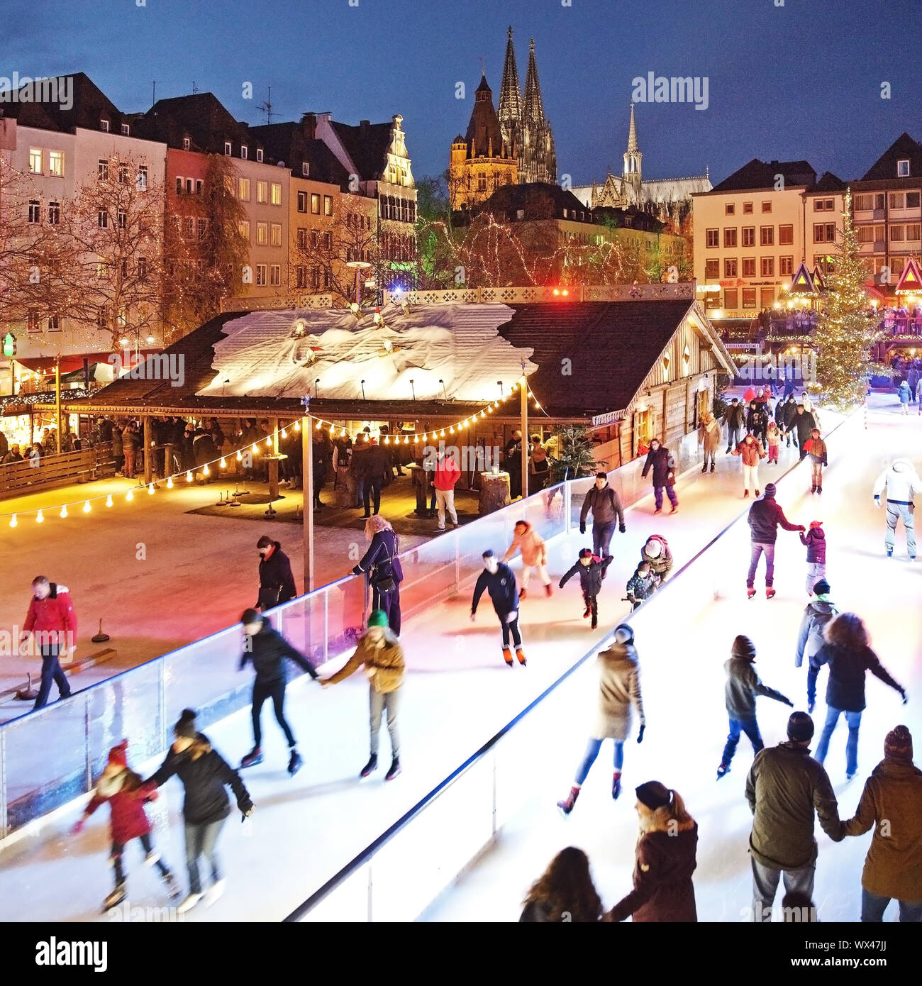 People on the illuminated ice rink on the Heumarkt, Cologne, North ...