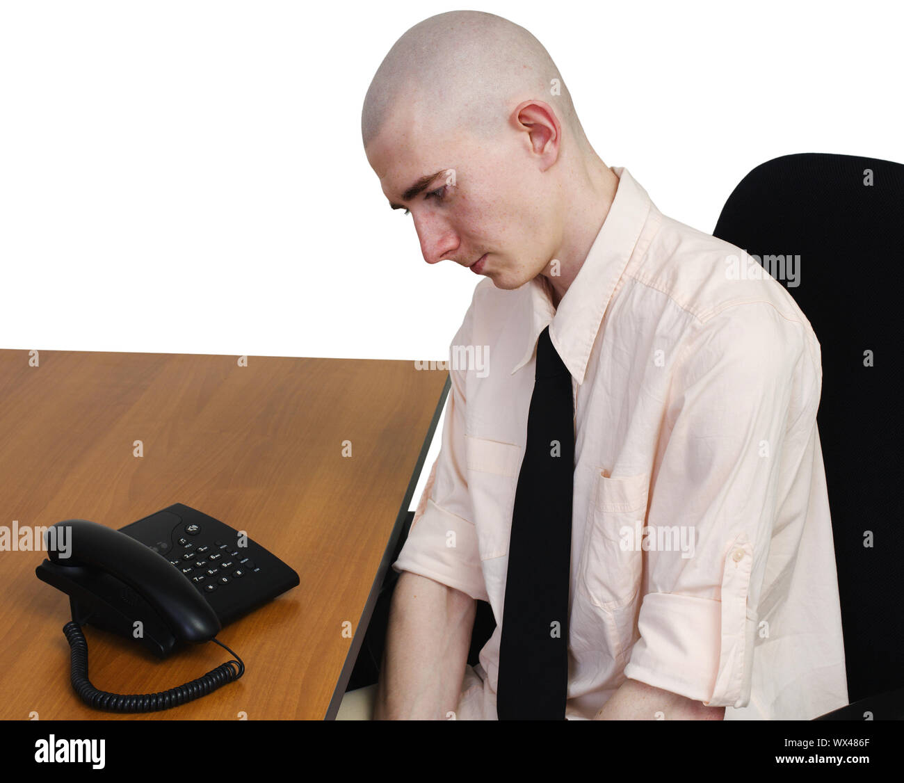 Man sits on easy chair in expectation of telephone call Stock Photo - Alamy