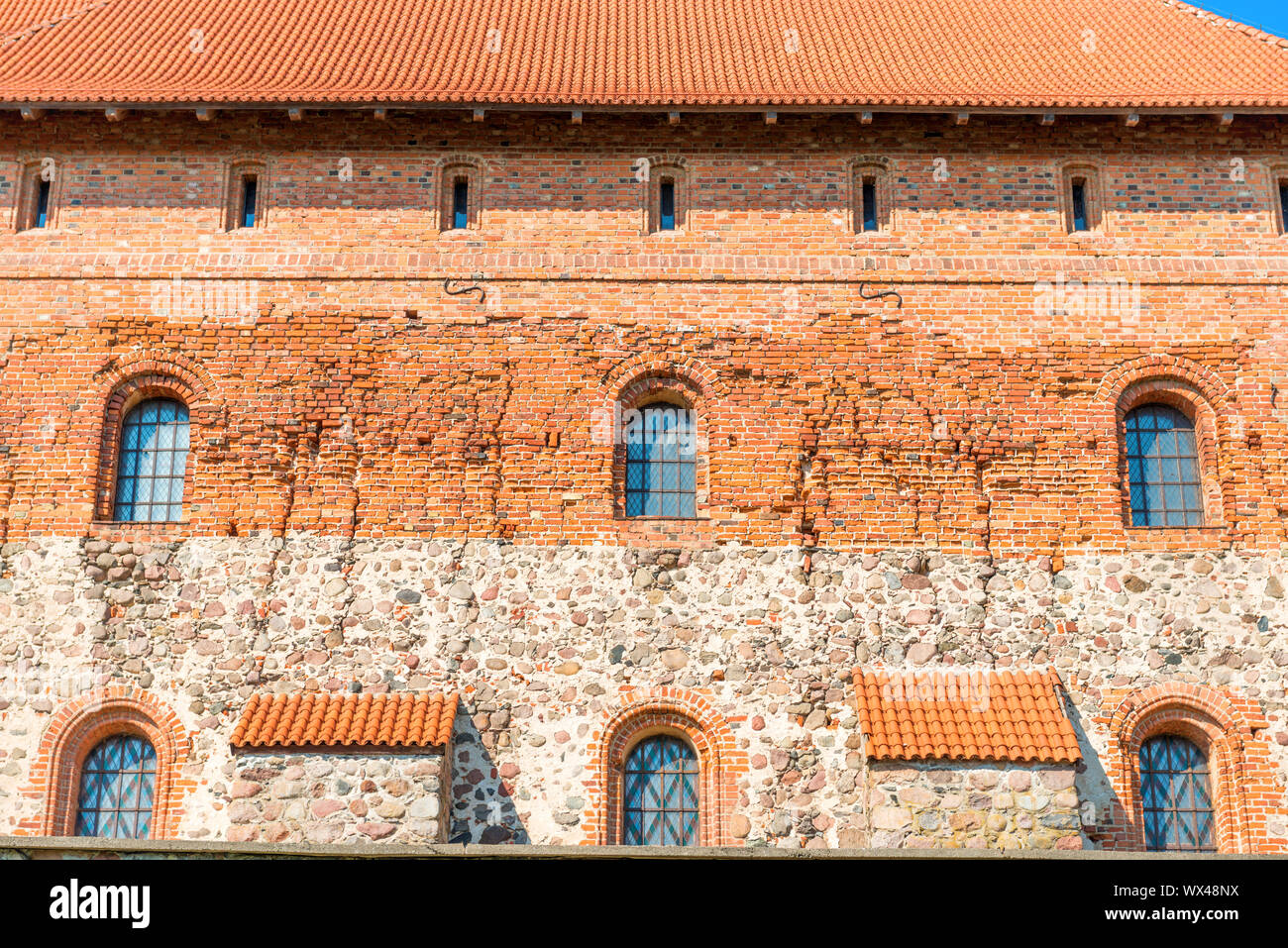 Brick castle wall with windows Stock Photo - Alamy