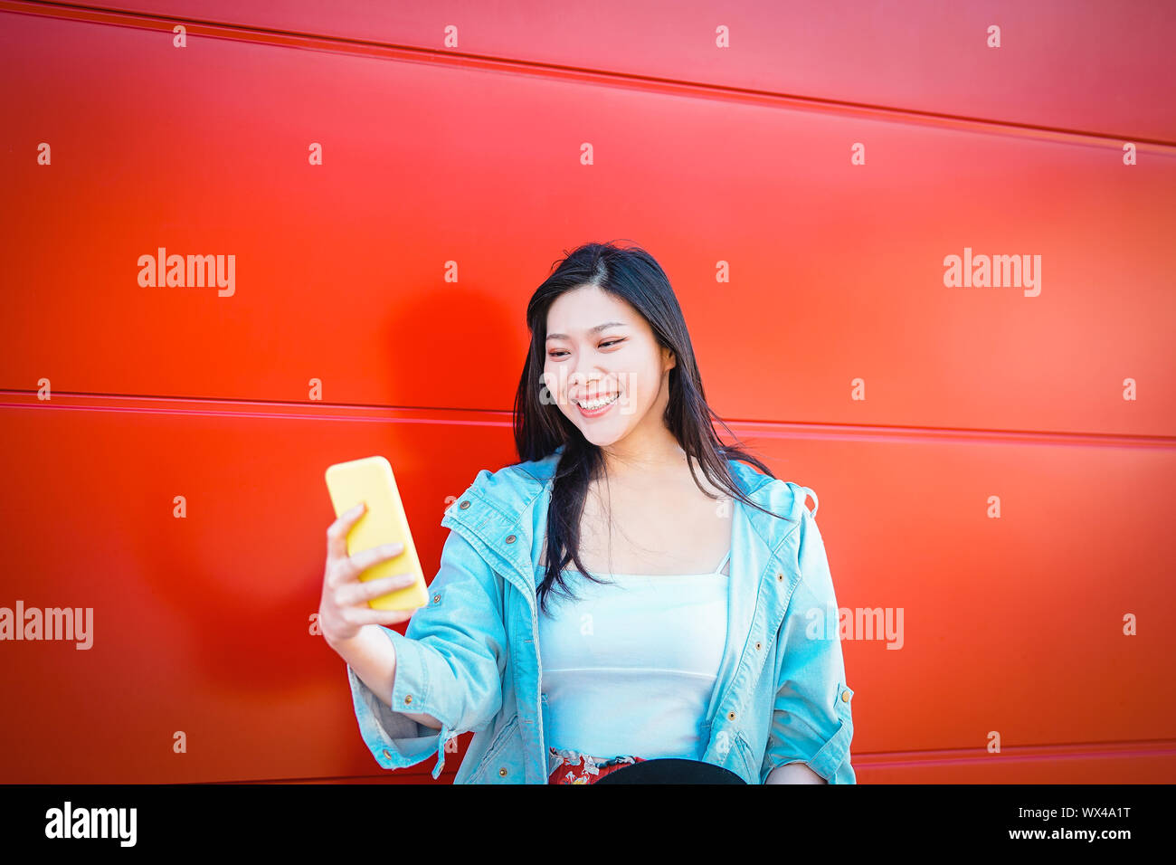 Happy asian influencer using mobile smart phone outdoor - Chinese ...
