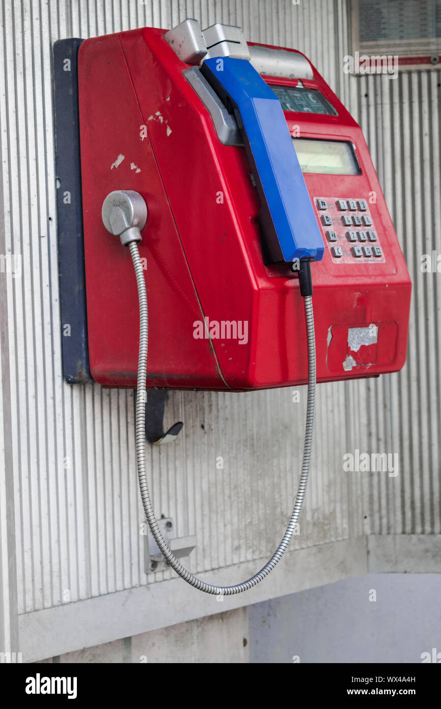 Old red and blue phone booth Stock Photo - Alamy