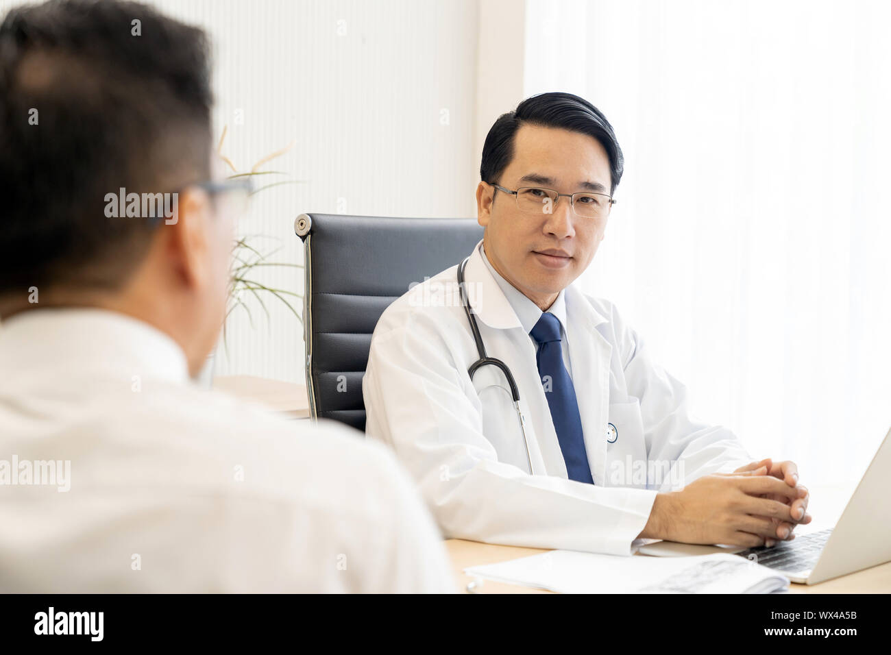 Doctor portrait in medical office Stock Photo - Alamy