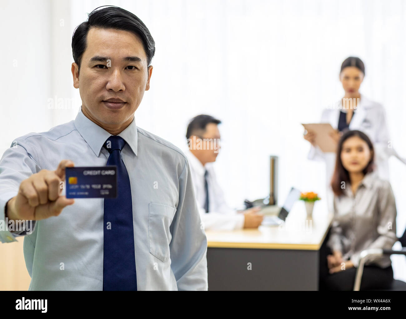 Patient with credit card for insurance concept Stock Photo - Alamy