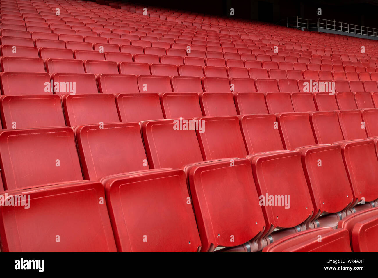 Red seat row in stadium Stock Photo - Alamy