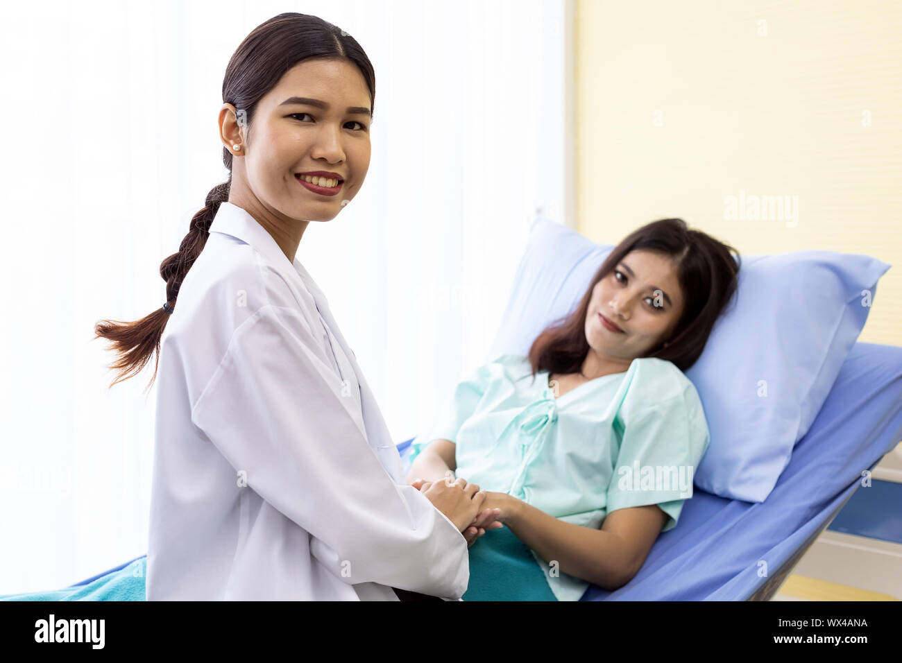 medical doctor hold patient hand Stock Photo - Alamy