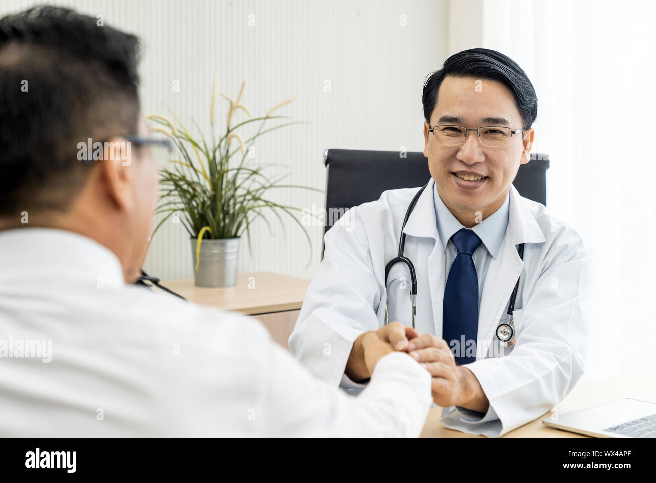 Doctor portrait in medical office Stock Photo - Alamy