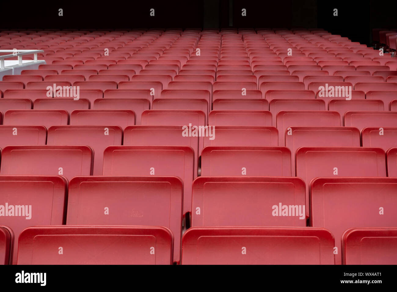 Red seat row in stadium Stock Photo - Alamy