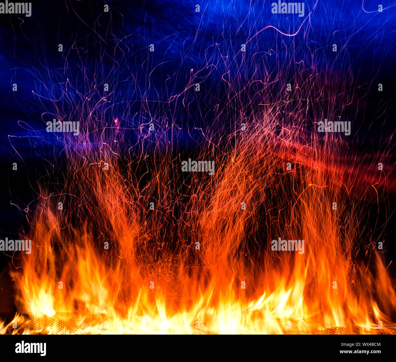 Fire photo on a dark blue background Stock Photo - Alamy