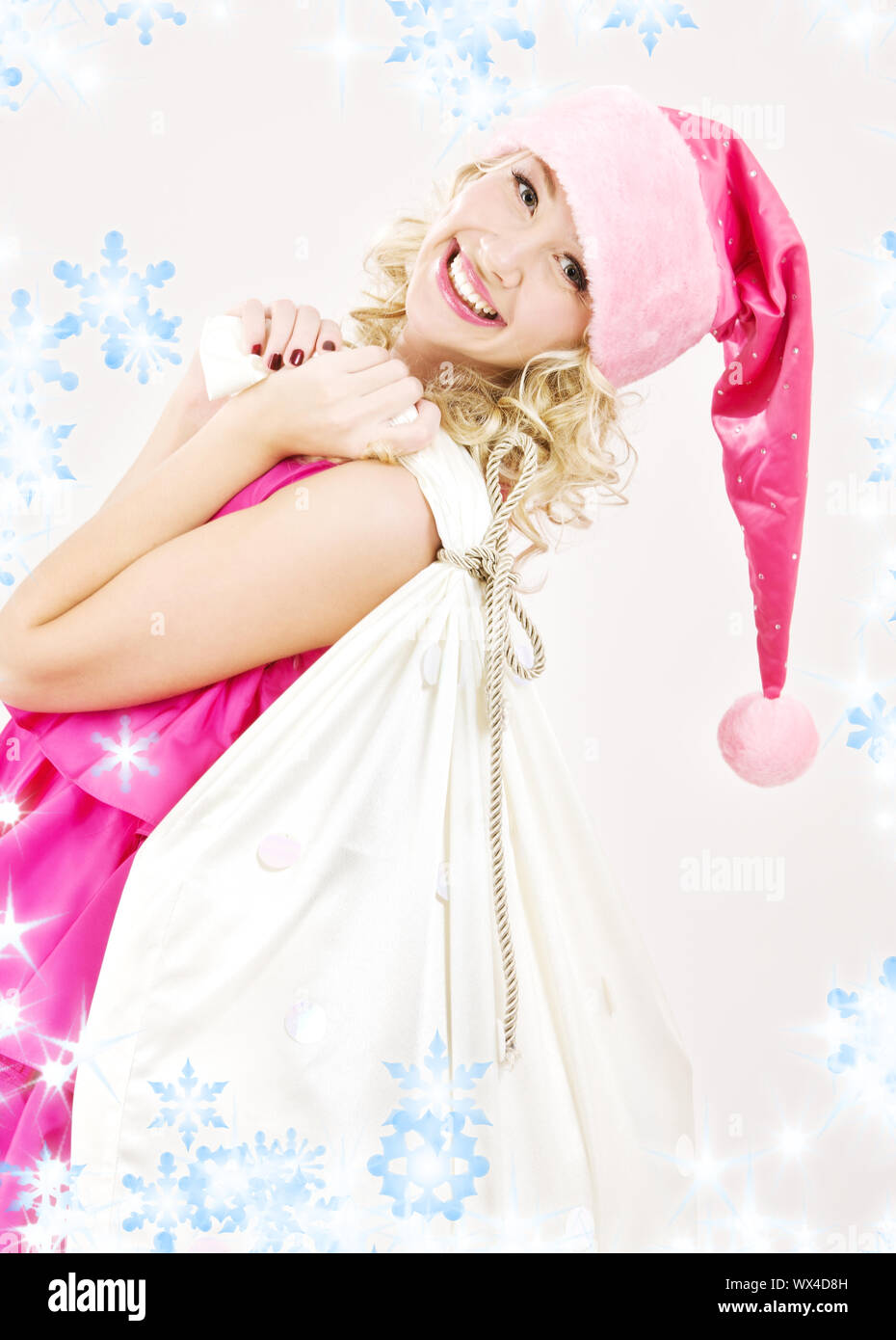 picture of cheerful santa helper girl with big bag Stock Photo - Alamy