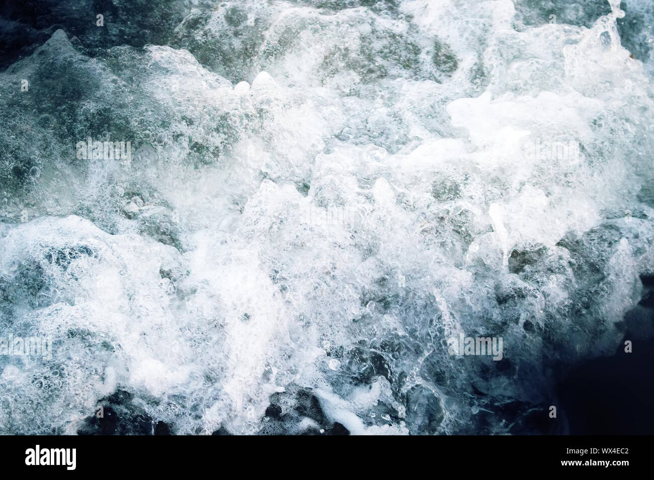 Oceanic waves during storm. Water roll forward and boils at shore ...