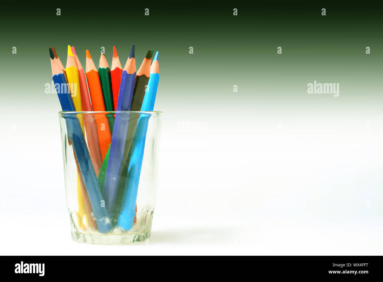 color pencil in glass macro close up on white Stock Photo - Alamy